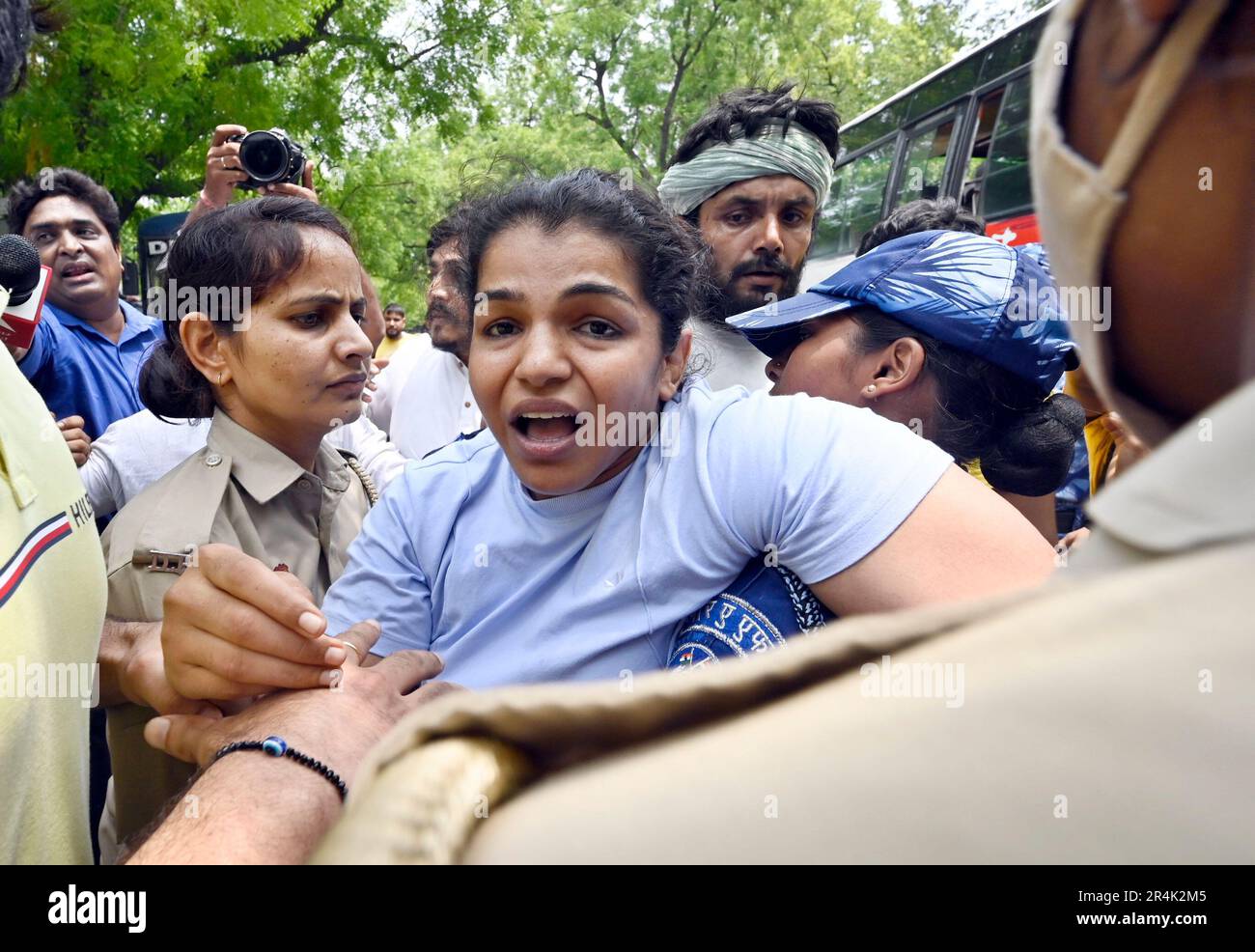 NEW DELHI, INDIA - MAY 28: Security personnel detain wrestler Sakshi ...