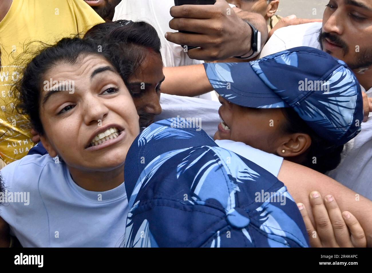 NEW DELHI, INDIA - MAY 28: Security personnel detain wrestler Sakshi ...