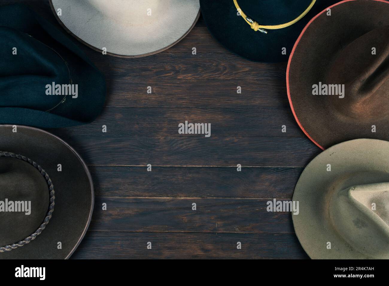 Old west hats on wooden table. Top view Stock Photo - Alamy