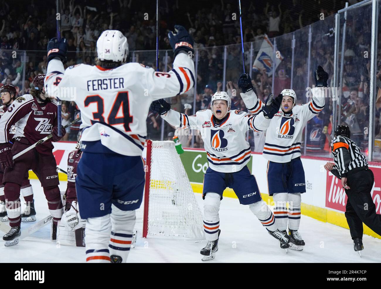 Kamloops Blazers' Ashton Ferster (34), Jakub Demek (27) and Shea Van ...