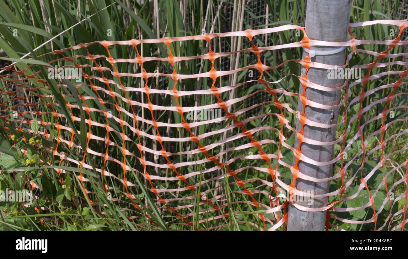 Orange plastic safety net Stock Photo - Alamy