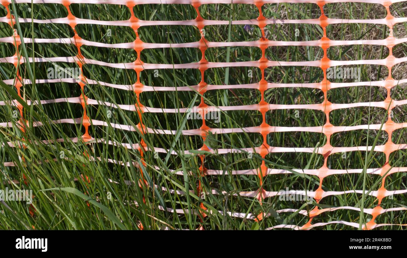 Orange plastic safety net Stock Photo - Alamy