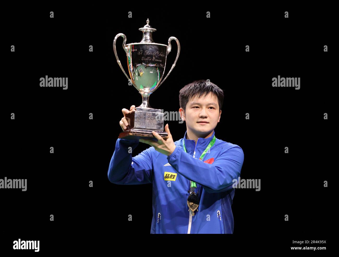 Fan Zhendong of China celebrates during an award ceremony of men's ...