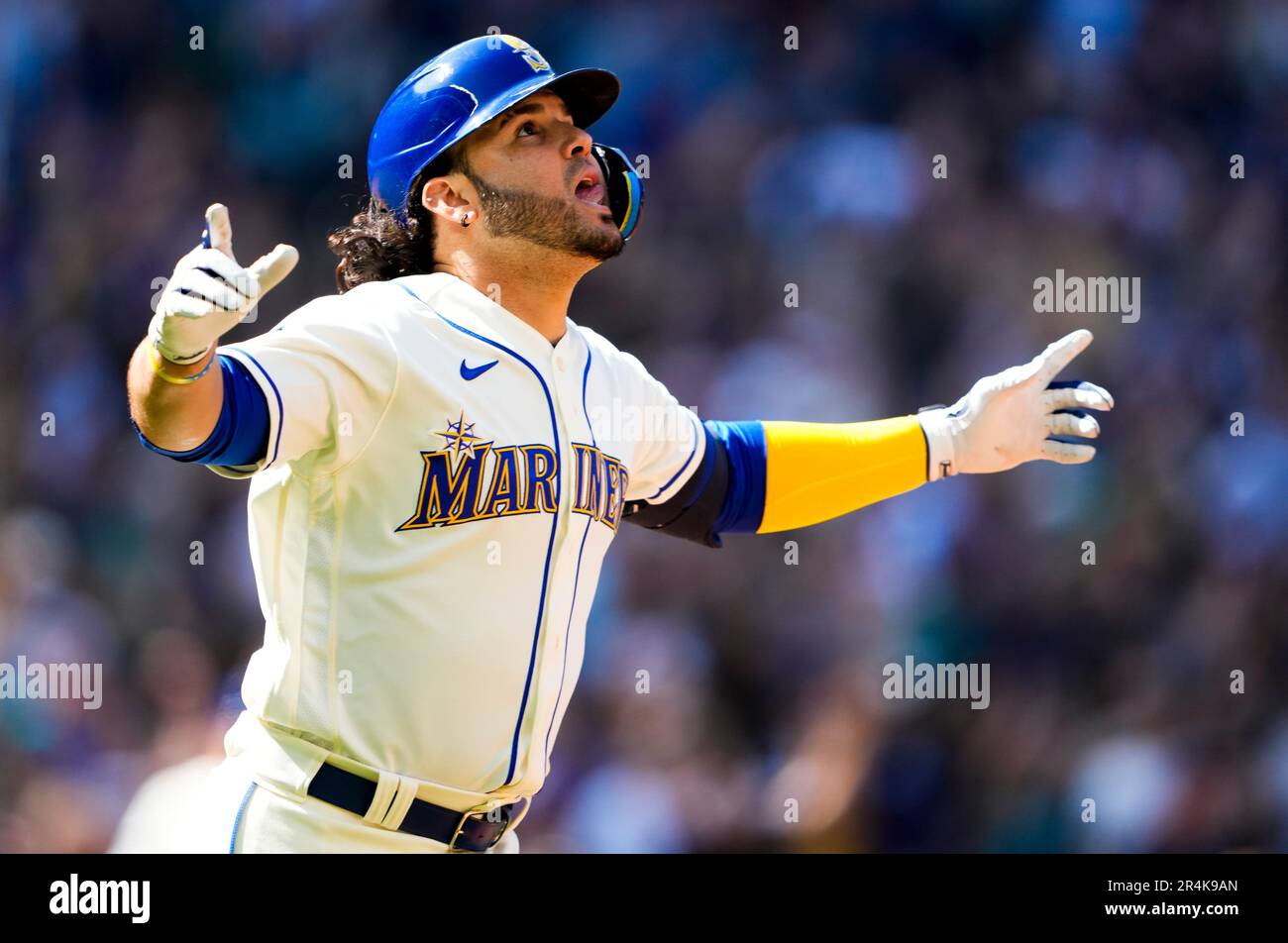 Seattle Mariners' Eugenio Suarez reacts as he runs the bases after ...