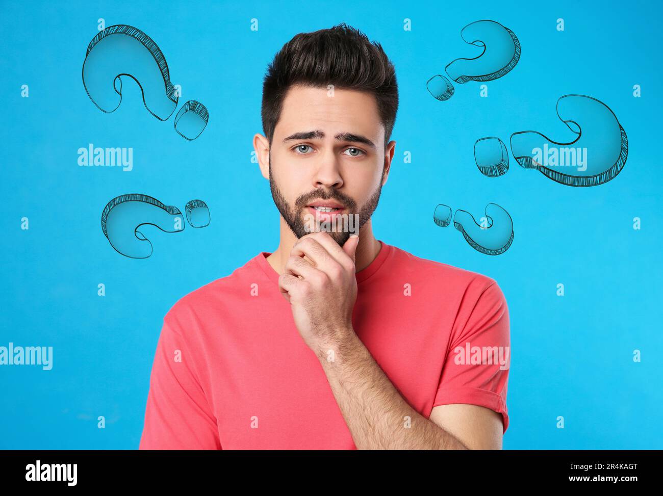 Young man thinking question marks hi-res stock photography and images ...