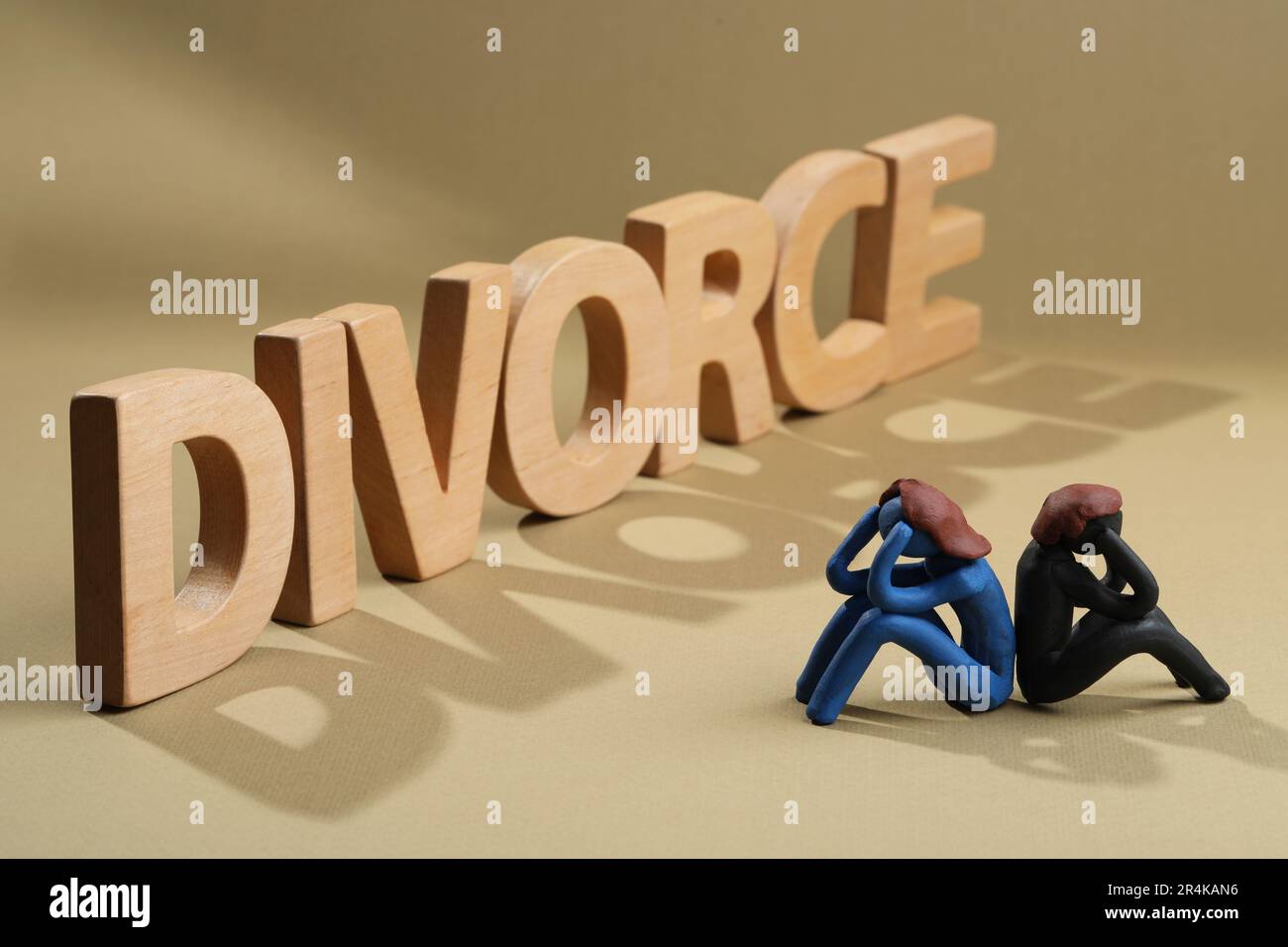 Word Divorce made of wooden letters and plasticine people figures on ...