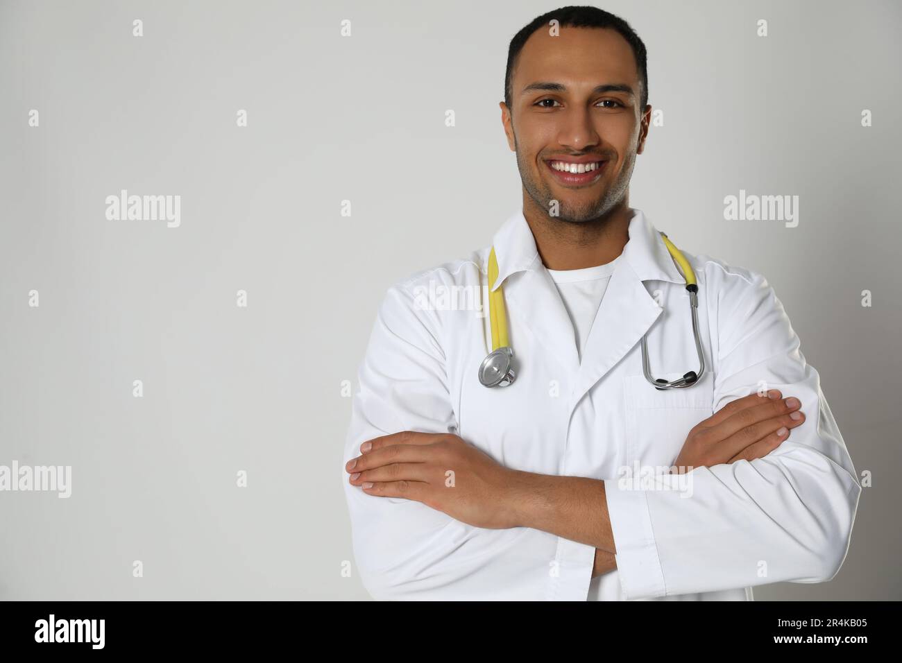 Doctor or medical assistant (male nurse) in uniform with stethoscope on ...