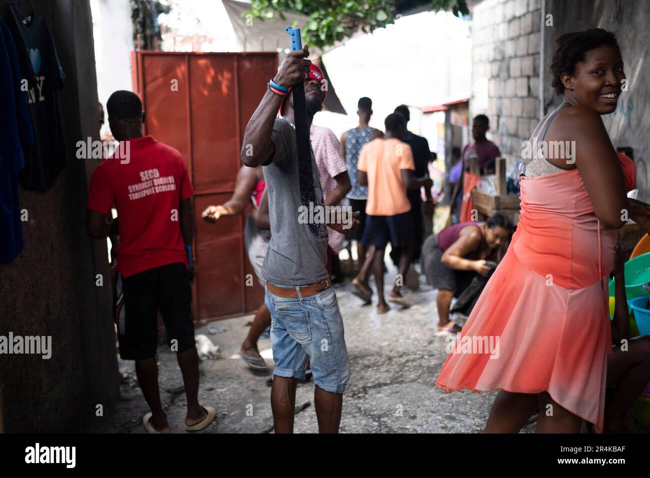 A man displays his machete as part of "Bwa Kale," an initiative to ...