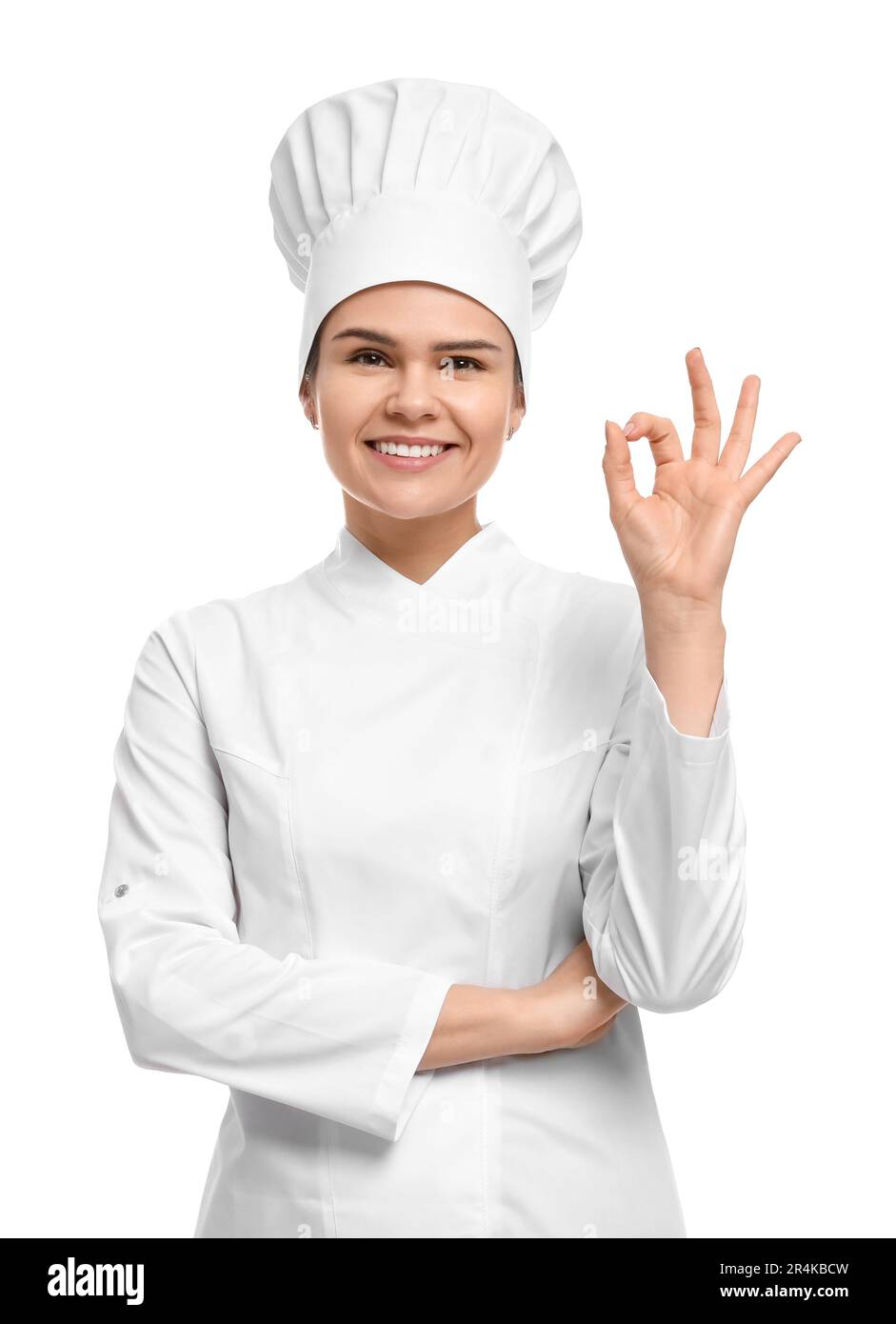 Happy female chef showing ok gesture on white background Stock Photo ...