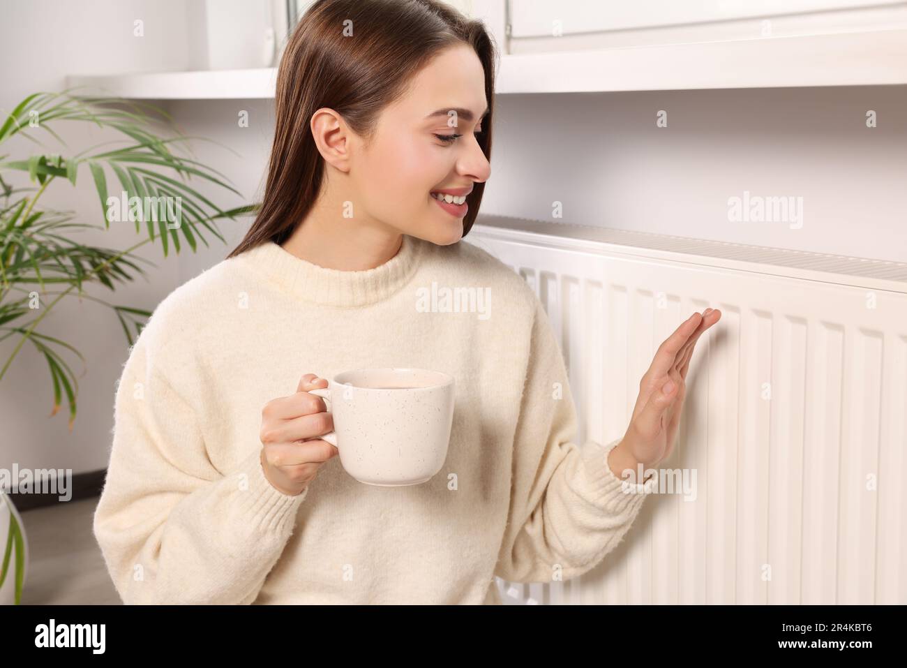 Hand warming cozy heater hi-res stock photography and images - Alamy