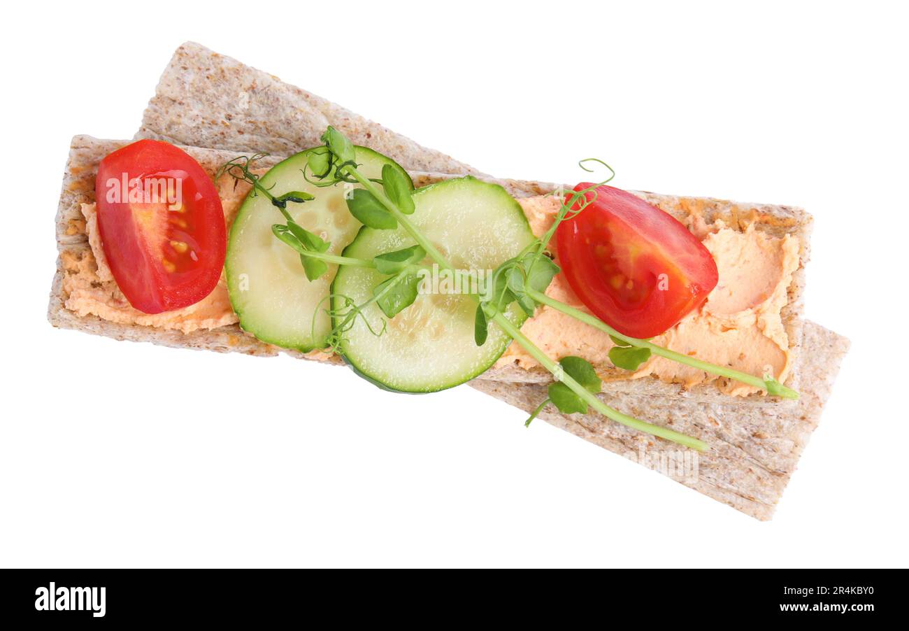 Tasty crispbreads with cream cheese and fresh vegetables isolated on ...