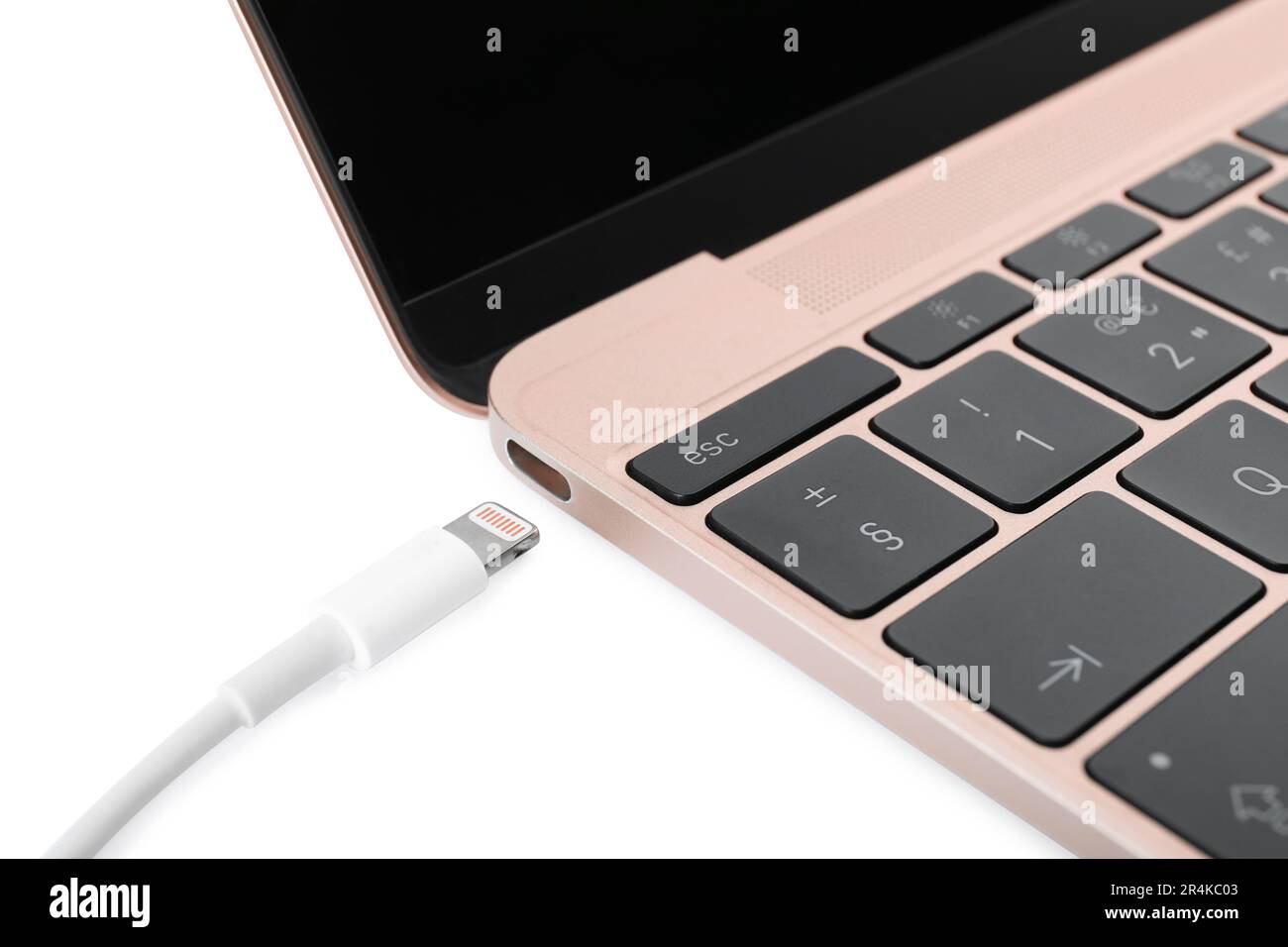 USB cable with lightning connector and laptop on white background Stock ...