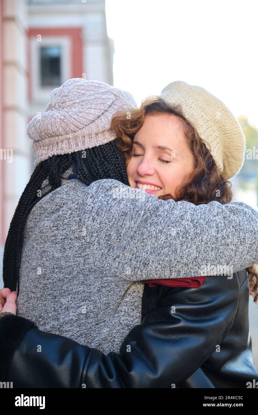 Two black women hugging each other hi-res stock photography and images ...