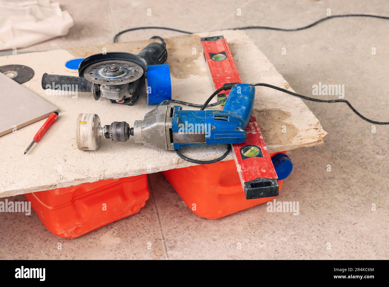 Buffing attachment drill and saw on chipboard indoors. Tiles ...