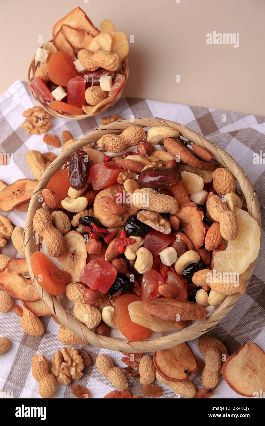Mixed dried fruits and nuts on beige background, flat lay Stock Photo - Alamy