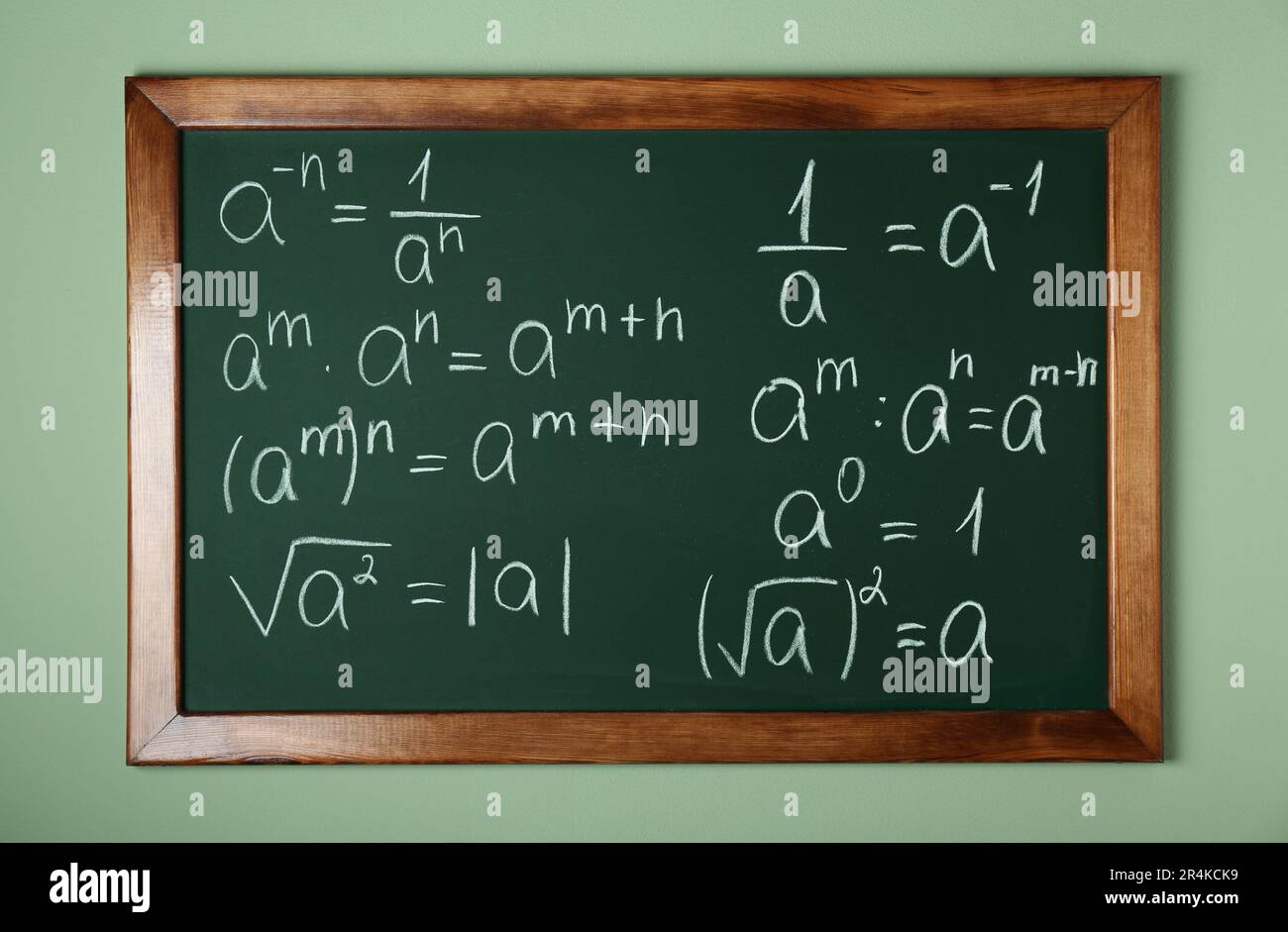 Chalkboard with many different math formulas on green wall Stock Photo ...