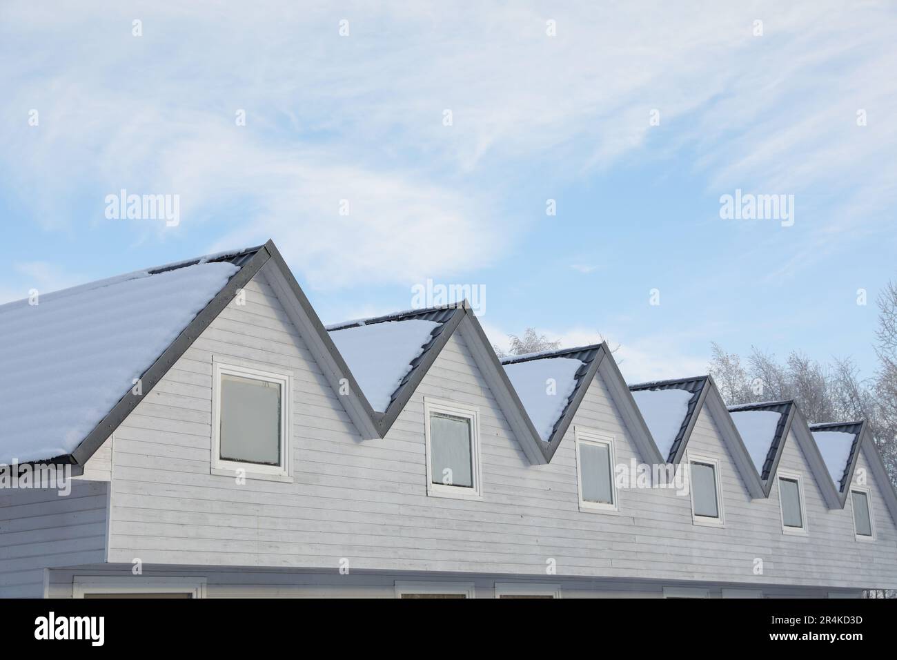 House roofs covered with snow under cloudy sky Stock Photo - Alamy