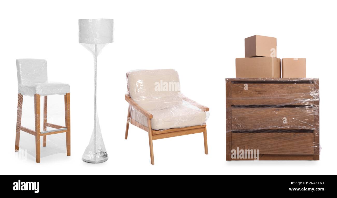 Furniture and lamp wrapped with stretch film and cardboard boxes on ...