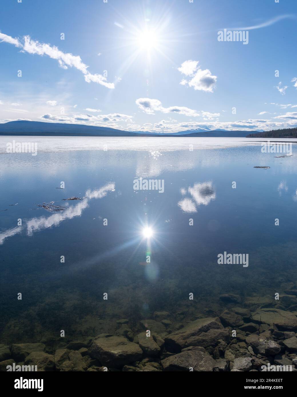 Stunning spring time lake reflections in beautiful calm pristine nature ...