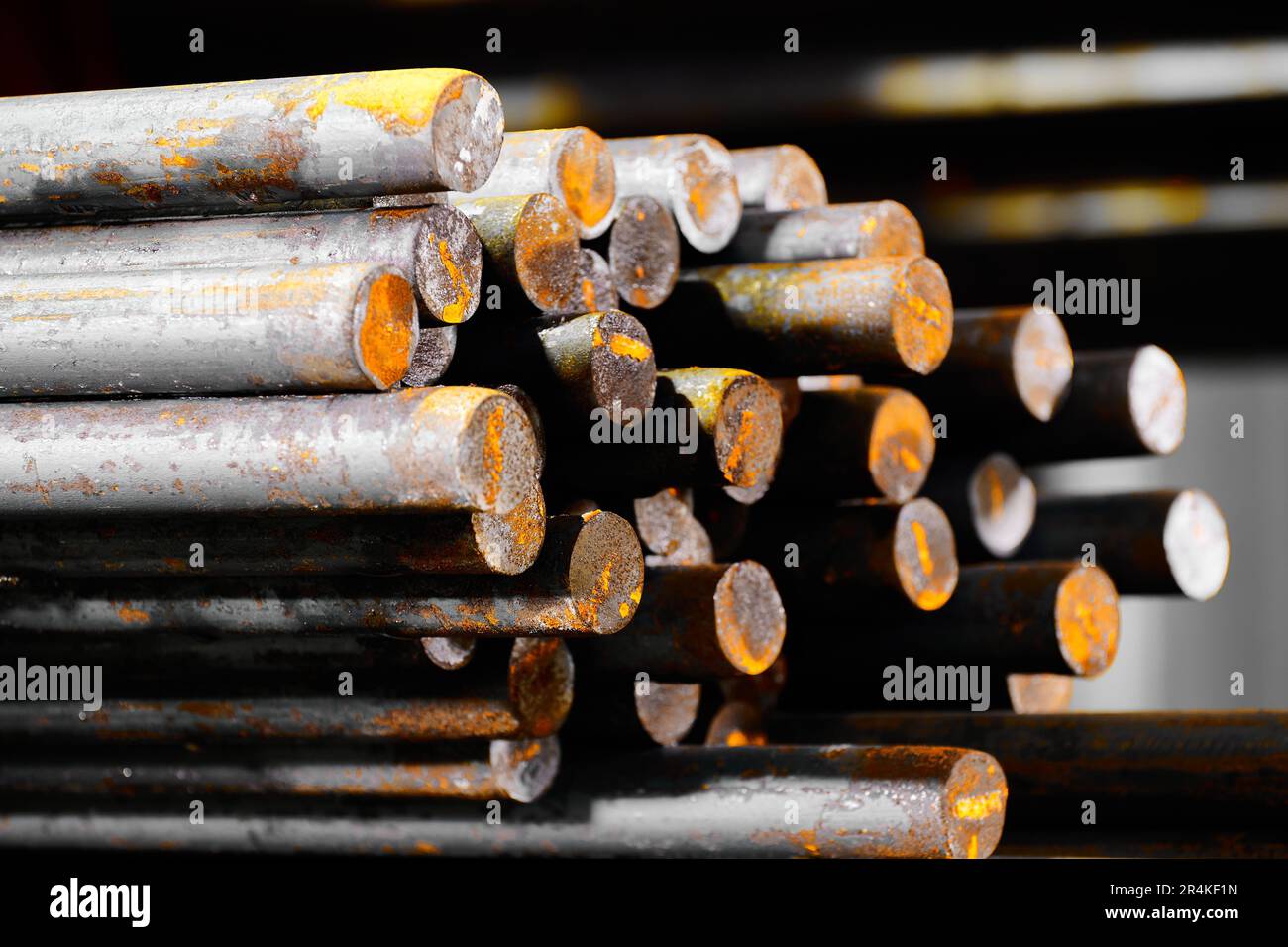 Round steel section rolling profile stacked at plant Stock Photo - Alamy