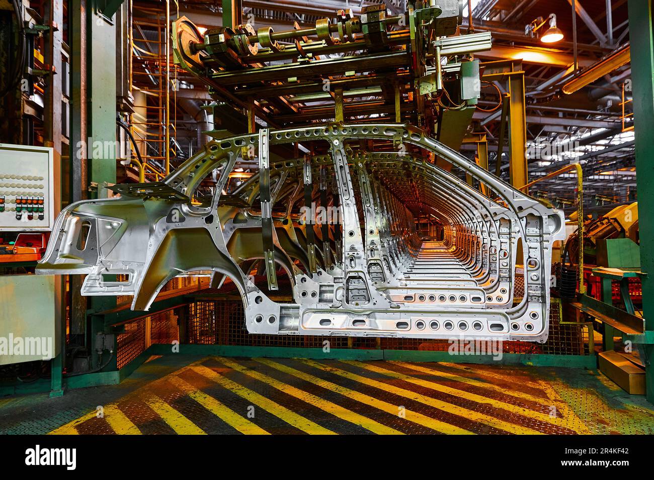 Passenger car carcass parts on assembling conveyor at plant Stock Photo ...