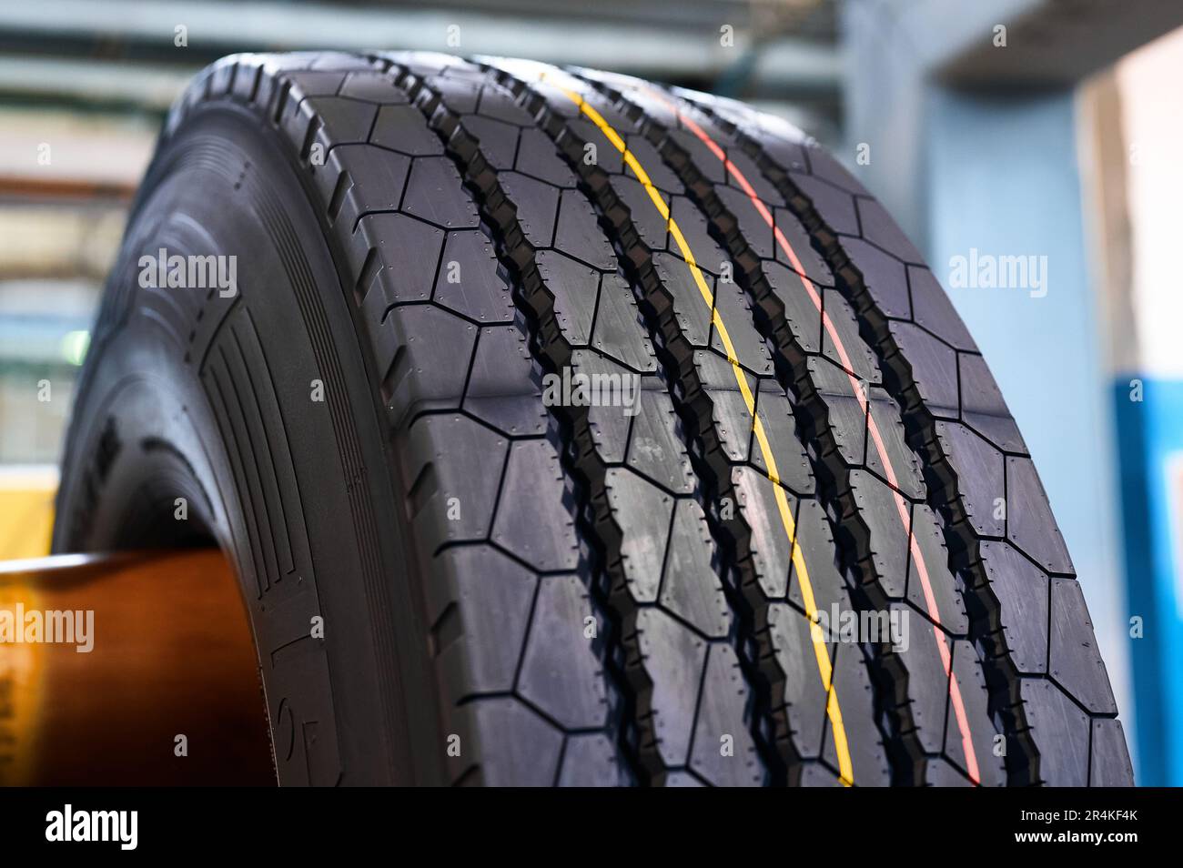 finished tire with yellow and pink color lines on rod at factory Stock ...