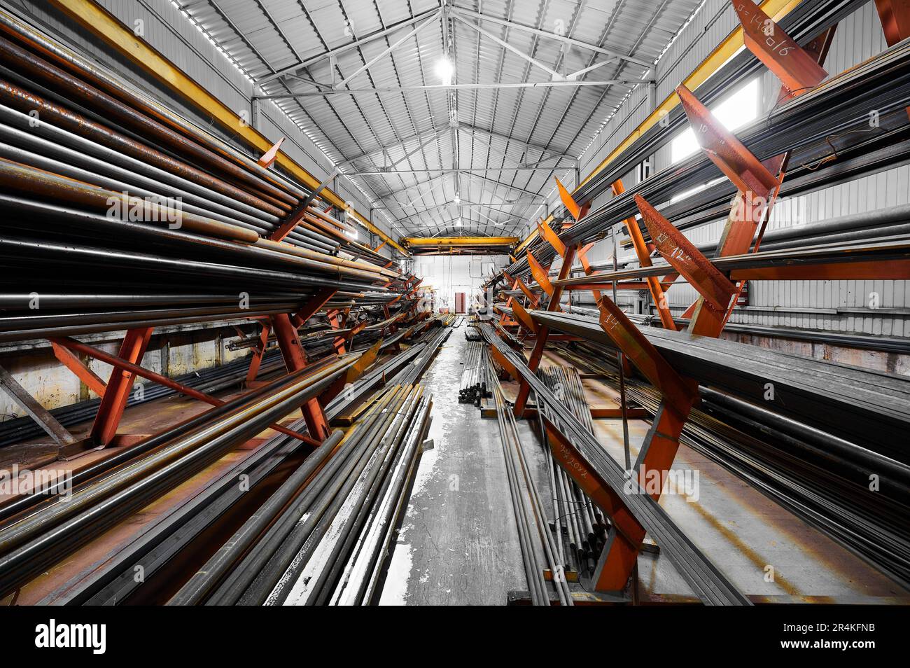 Cold rolled pipes stacked on shelving unit in plant storage Stock Photo ...
