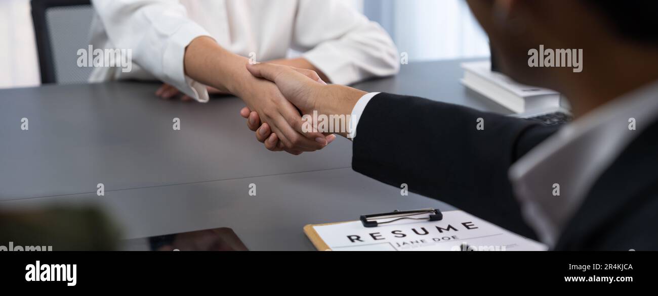 Interviewer handshaking the applicant hi-res stock photography and ...
