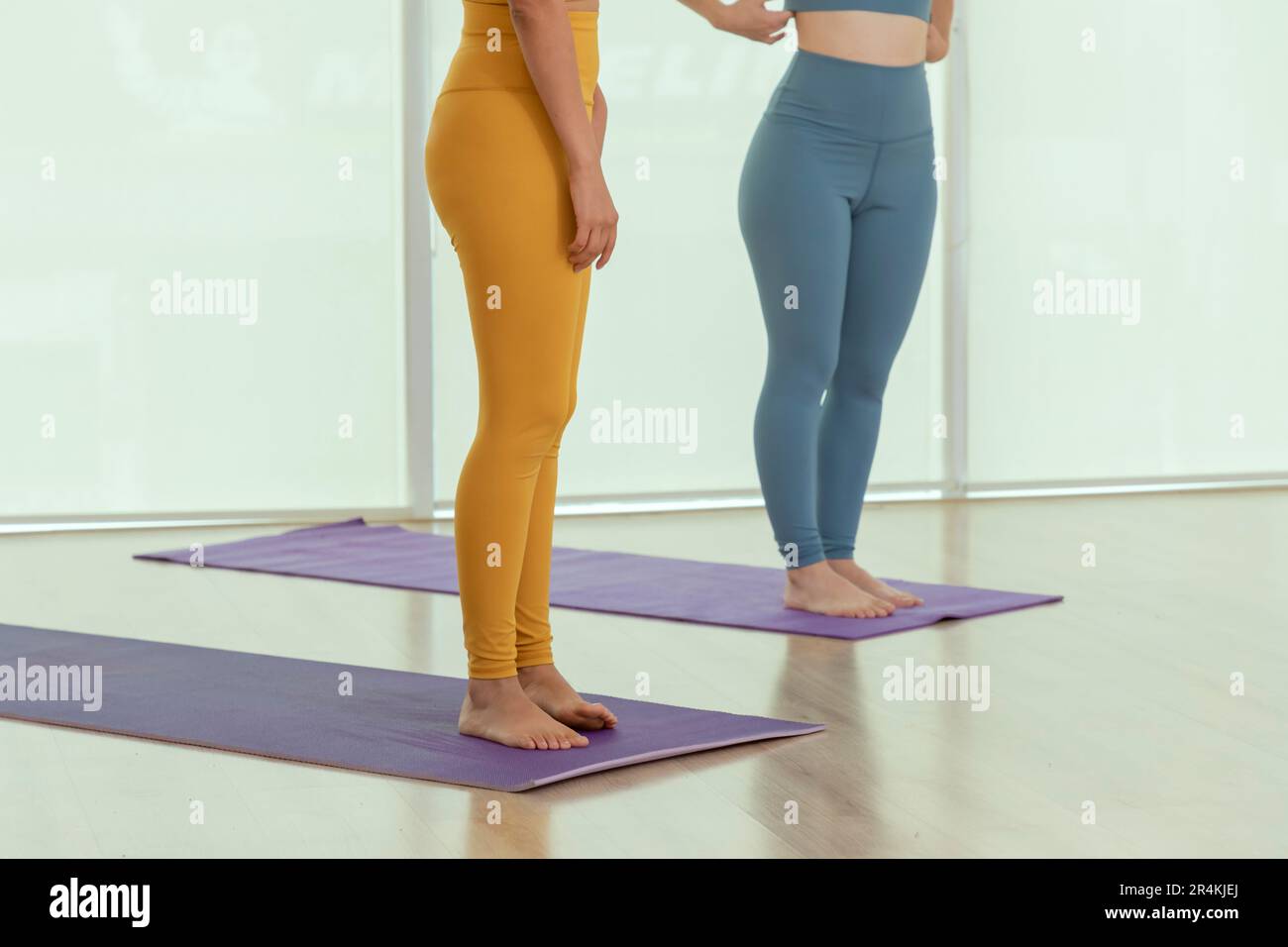 Close-up of the feet of two women who are practicing yoga Stock Photo ...