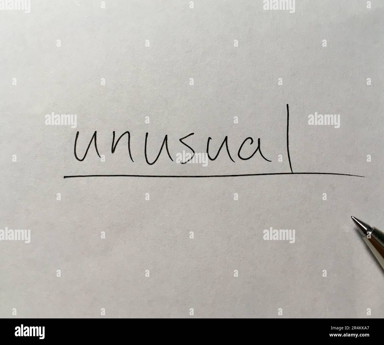Unusual concept word on paper background Stock Photo - Alamy