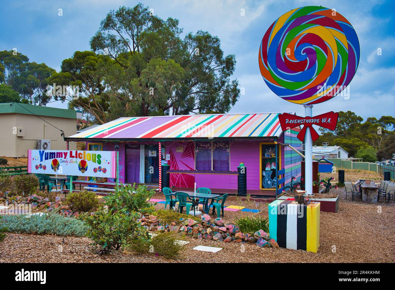 Colorful candy shop with a huge lollipop in front in the Western ...