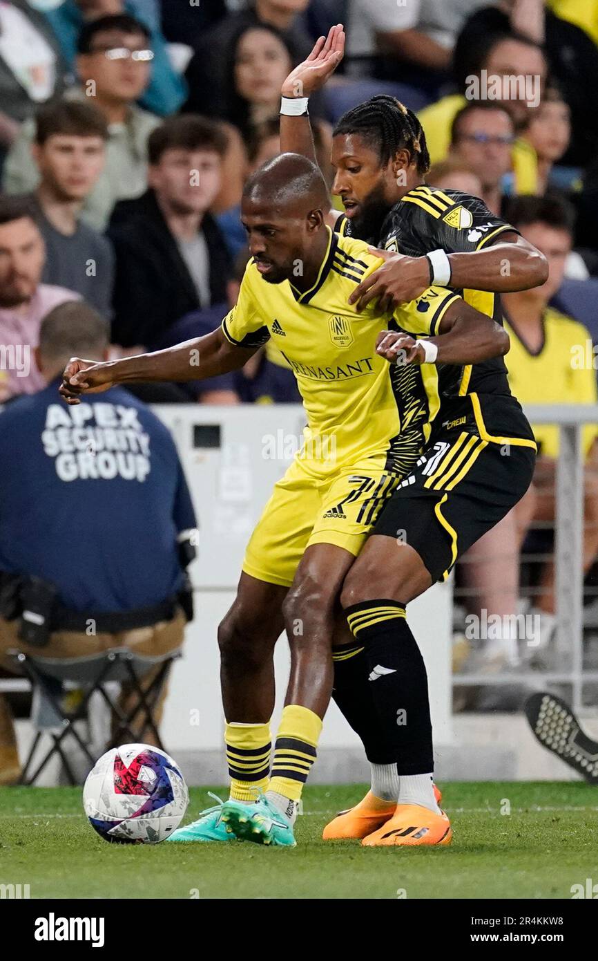 Nashville SC midfielder Fafà Picault, left, tries to get the ball past ...