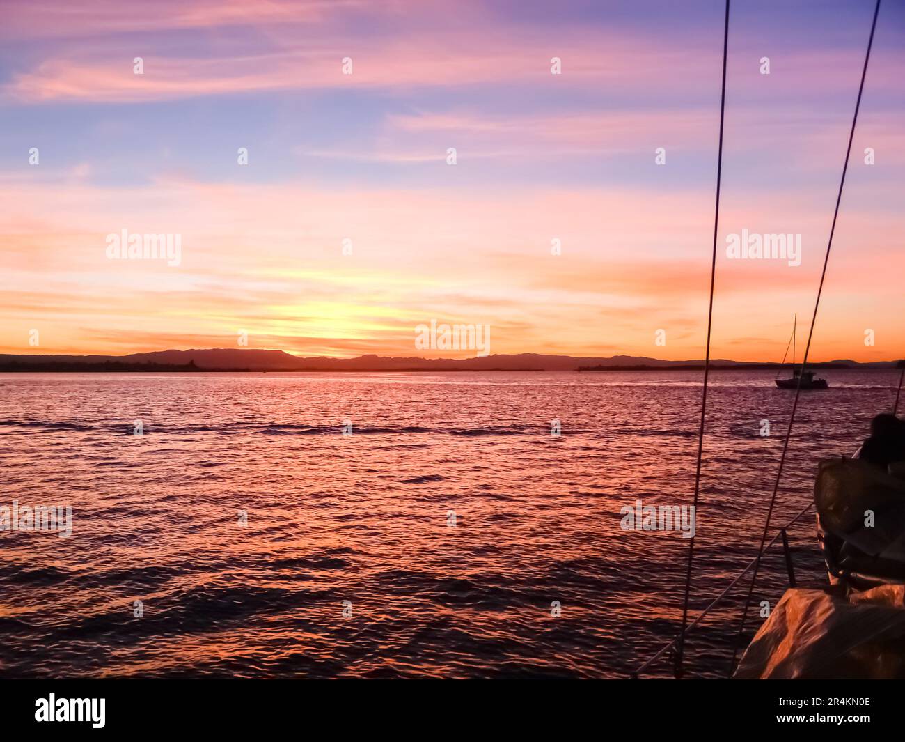 Magnificent and intense sunset from sailing yacht on Tauranga harbour ...
