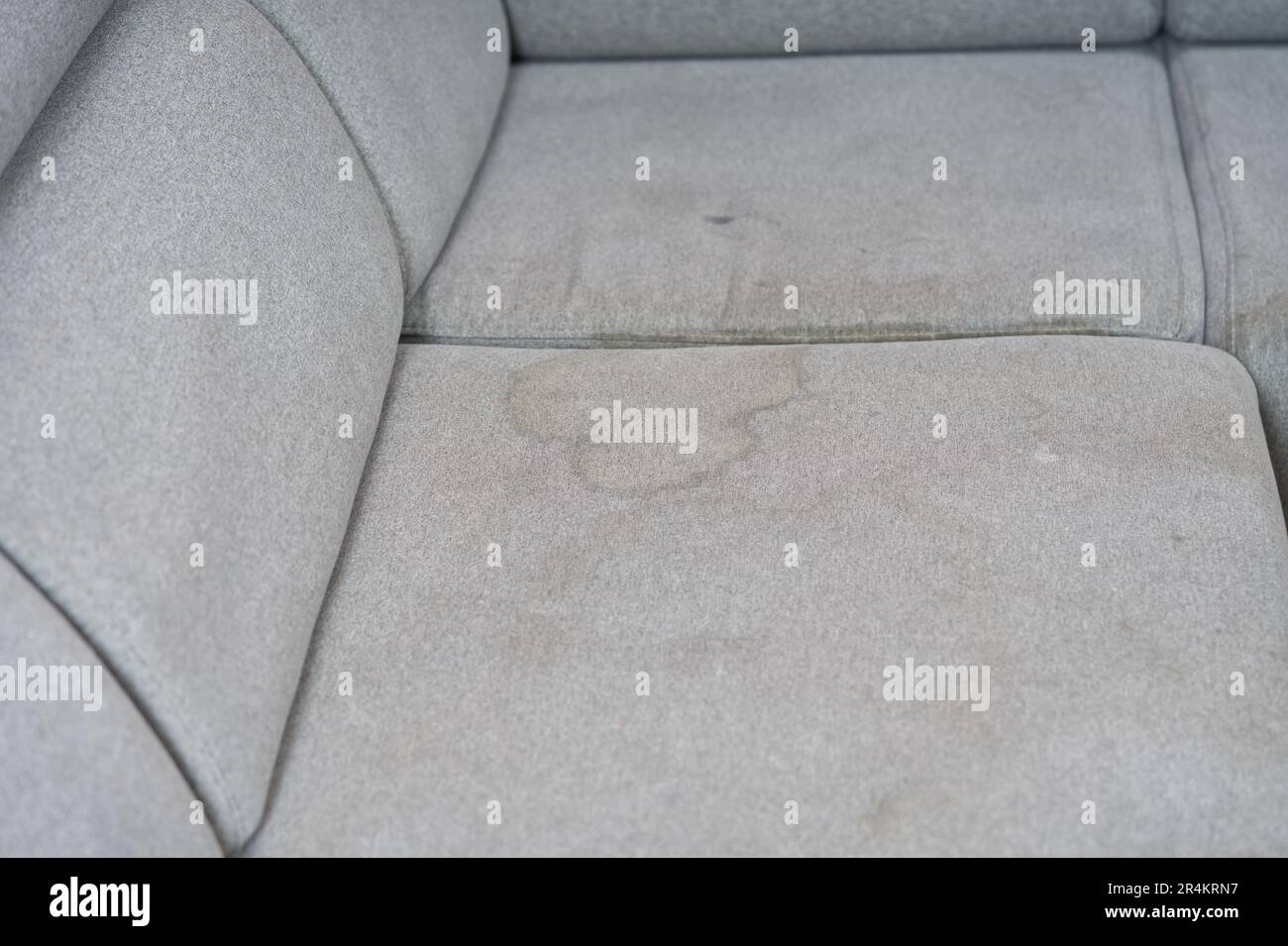 Dirty, stain, blot, fleck of water on the fabric, textile sofa. Dirty ...