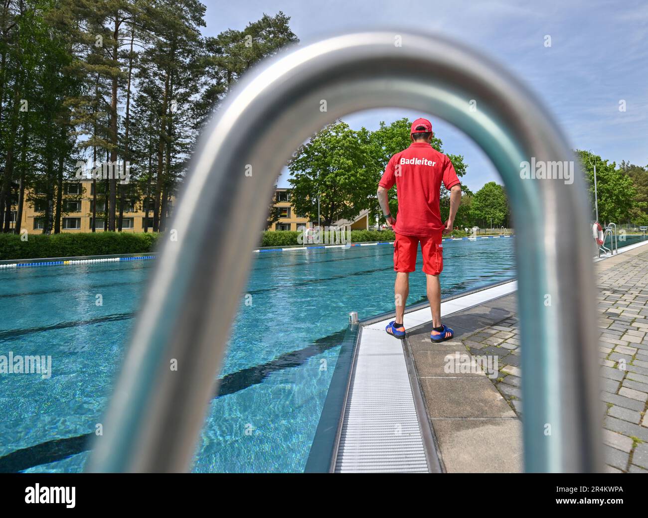 Bernau, Germany. 22nd May, 2023. A pool director and lifeguard stands ...