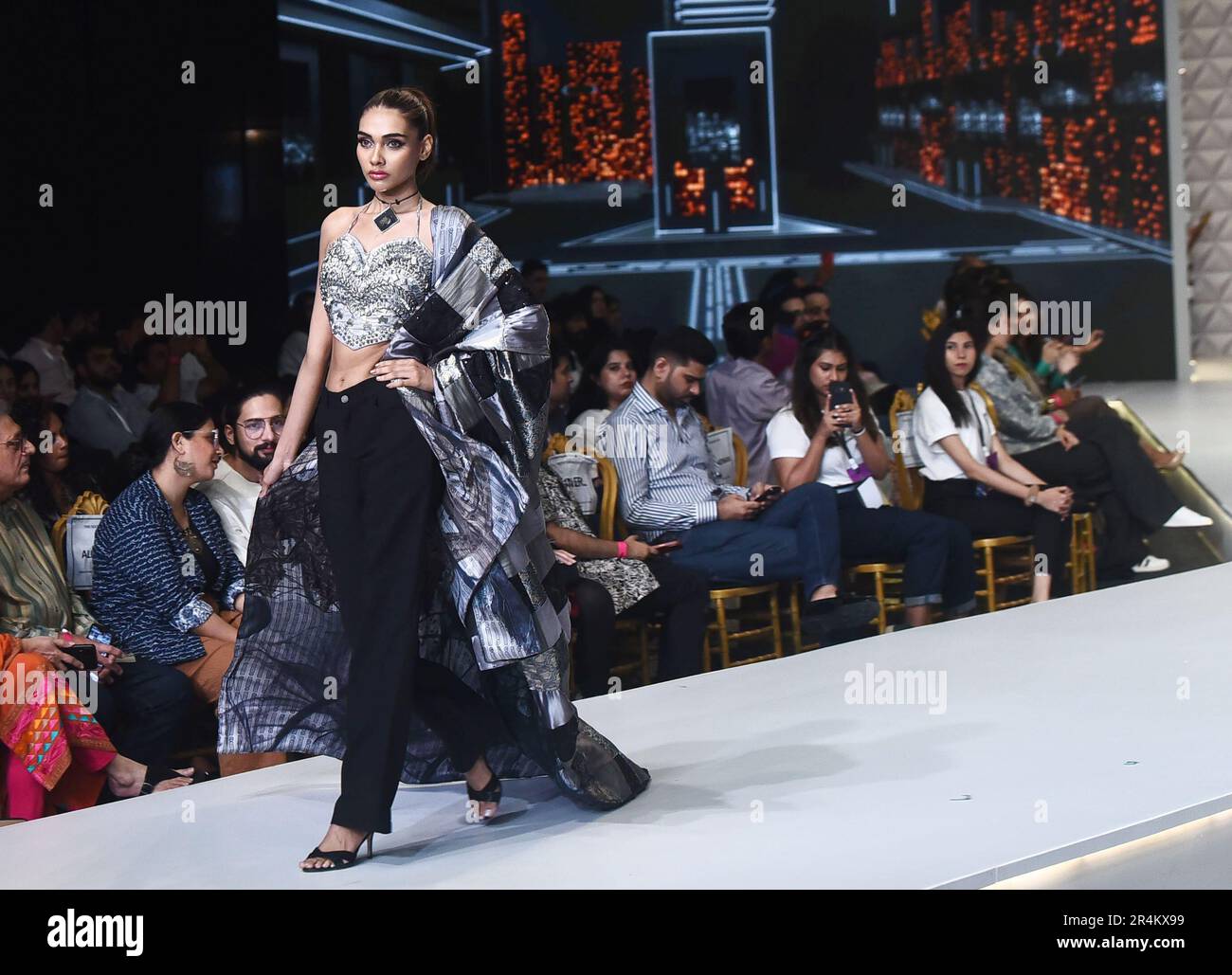 Karachi. 27th May, 2023. A model presents a creation during a fashion ...