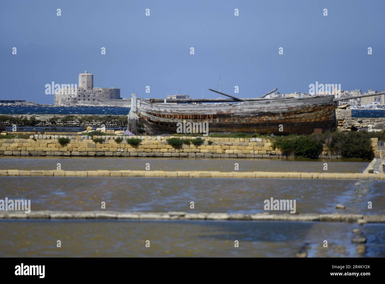 Scenic view of Castello della Colombaia as seen from the salt pan Salina Calcara, Nubia Natural ...