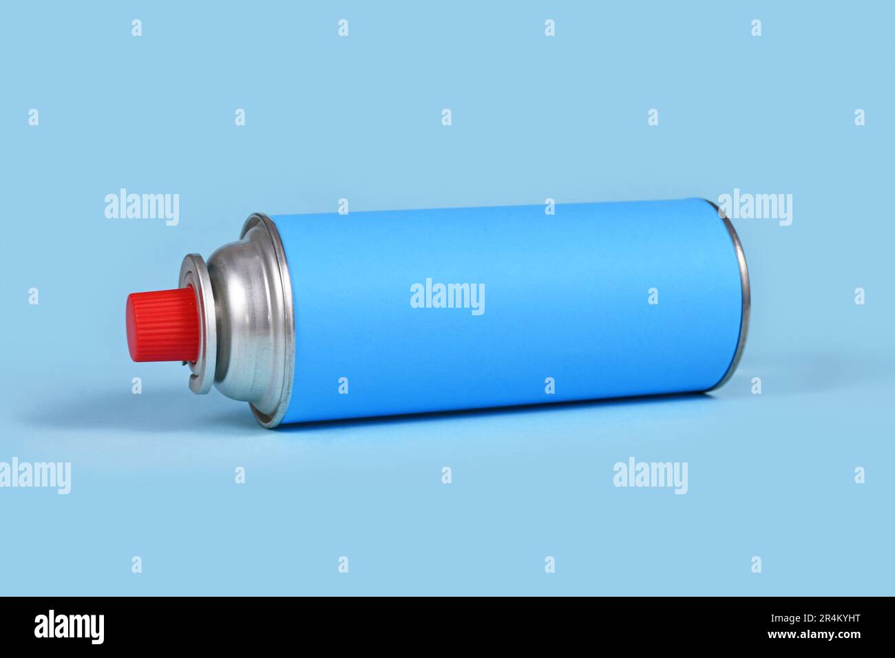 Simple gas cartridge bottle on blue background Stock Photo - Alamy