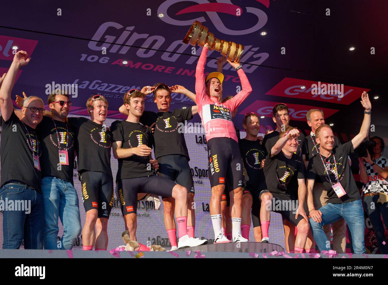 Primoz Roglic and Team Jumbo-Visma team celebrate at podium with the ...