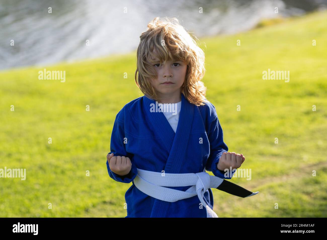Kid boy practicing karate outdoor. Sport karate kids. Little boy ...
