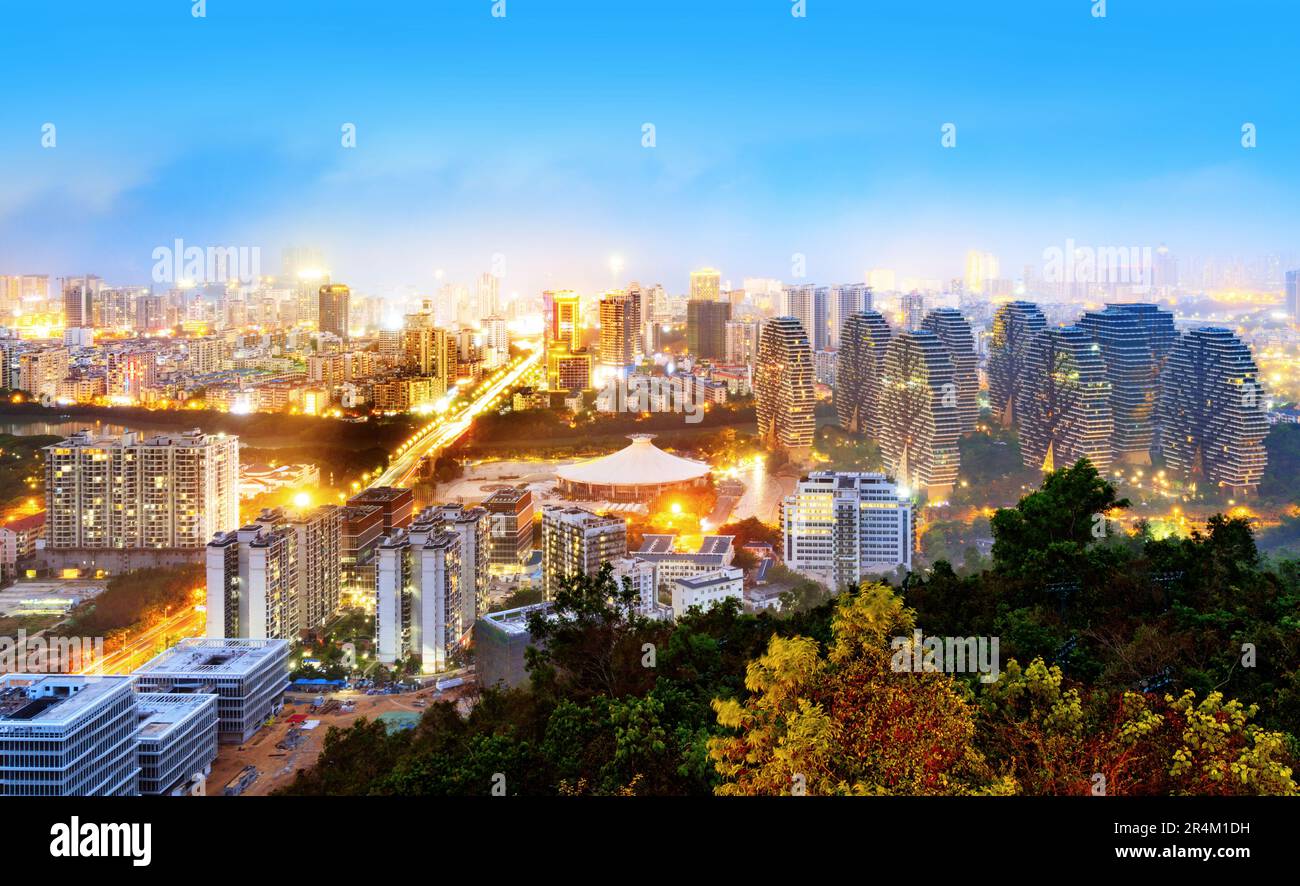 Bird's-eye view of the coastal city, Sanya, Hainan, China at night ...