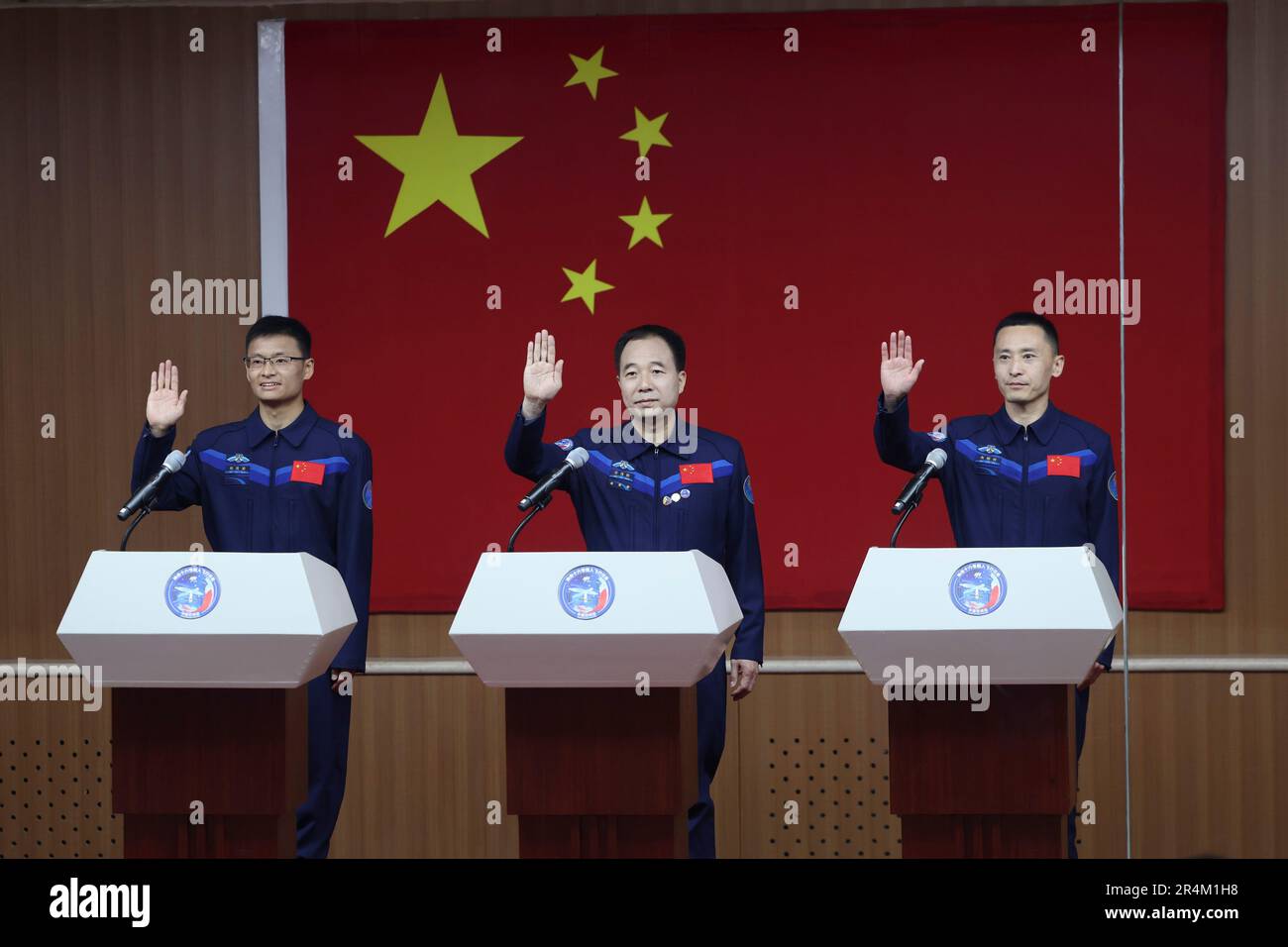 Jiuquan. 29th May, 2023. Chinese taikonauts Jing Haipeng (C), Zhu ...