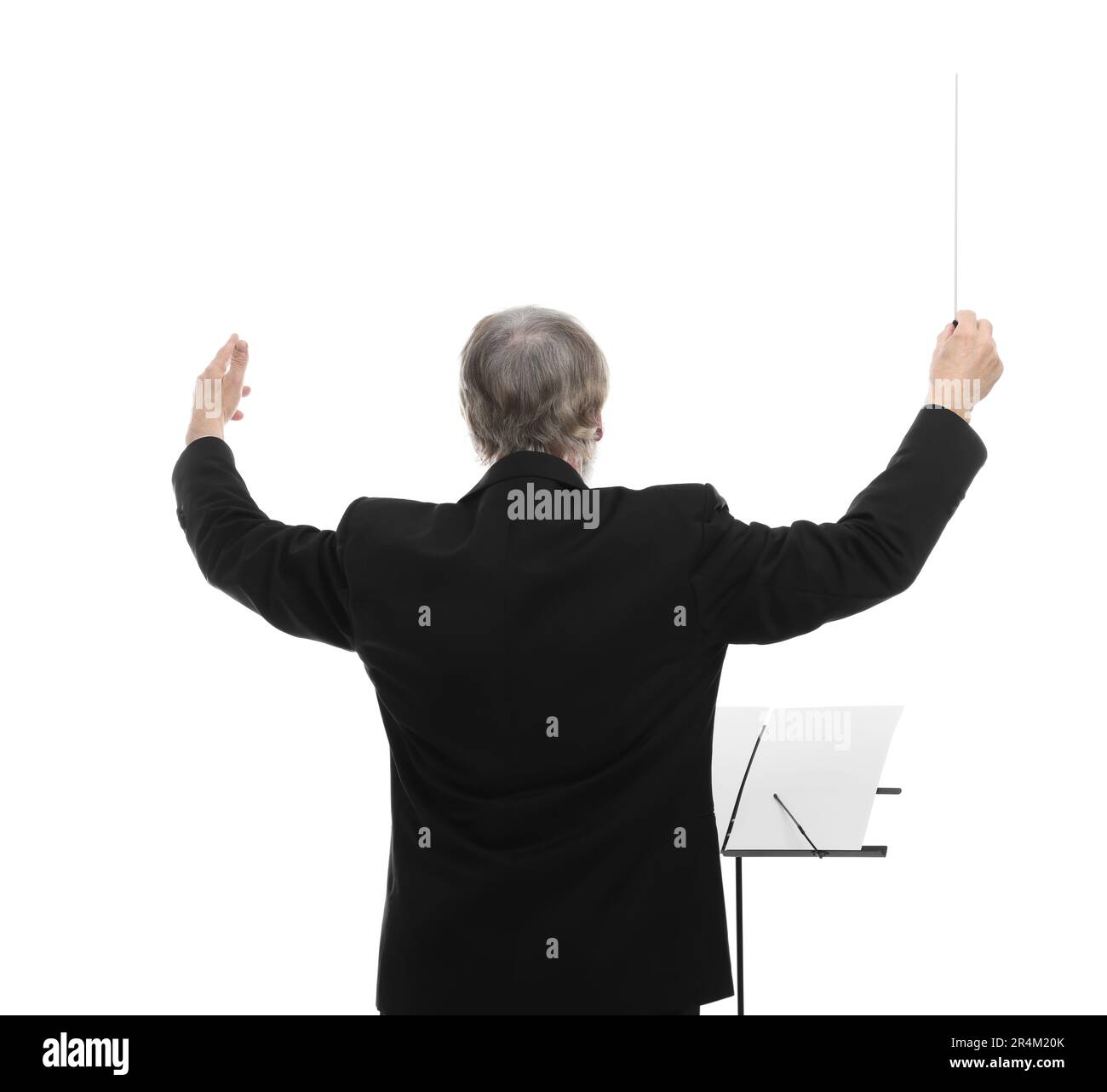 Professional conductor with baton and note stand on white background ...