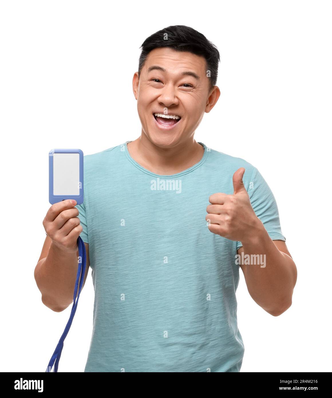 Happy asian man with vip pass badge showing thumbs up on white ...