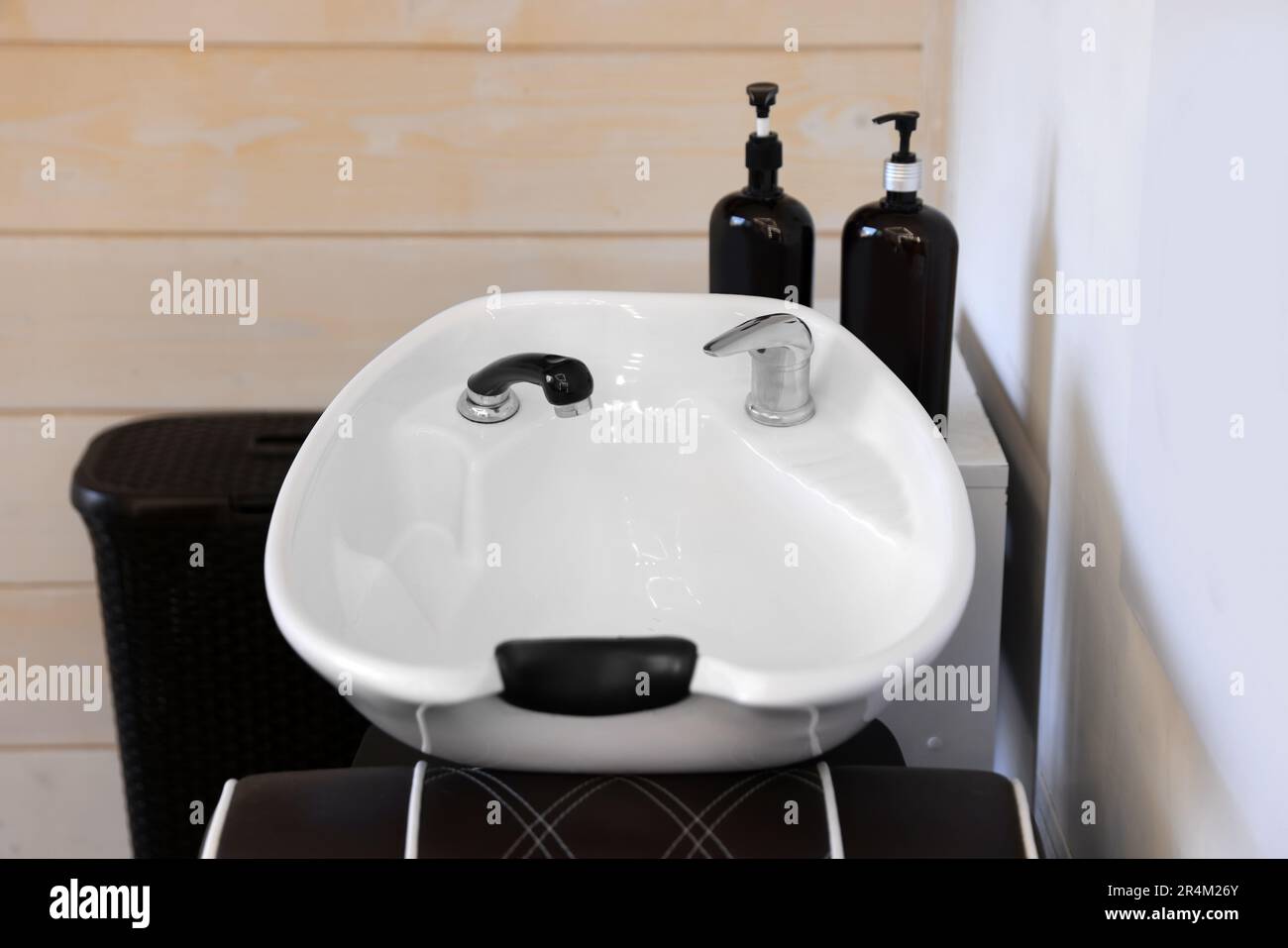 Modern wash unit with professional care products in barbershop Stock ...