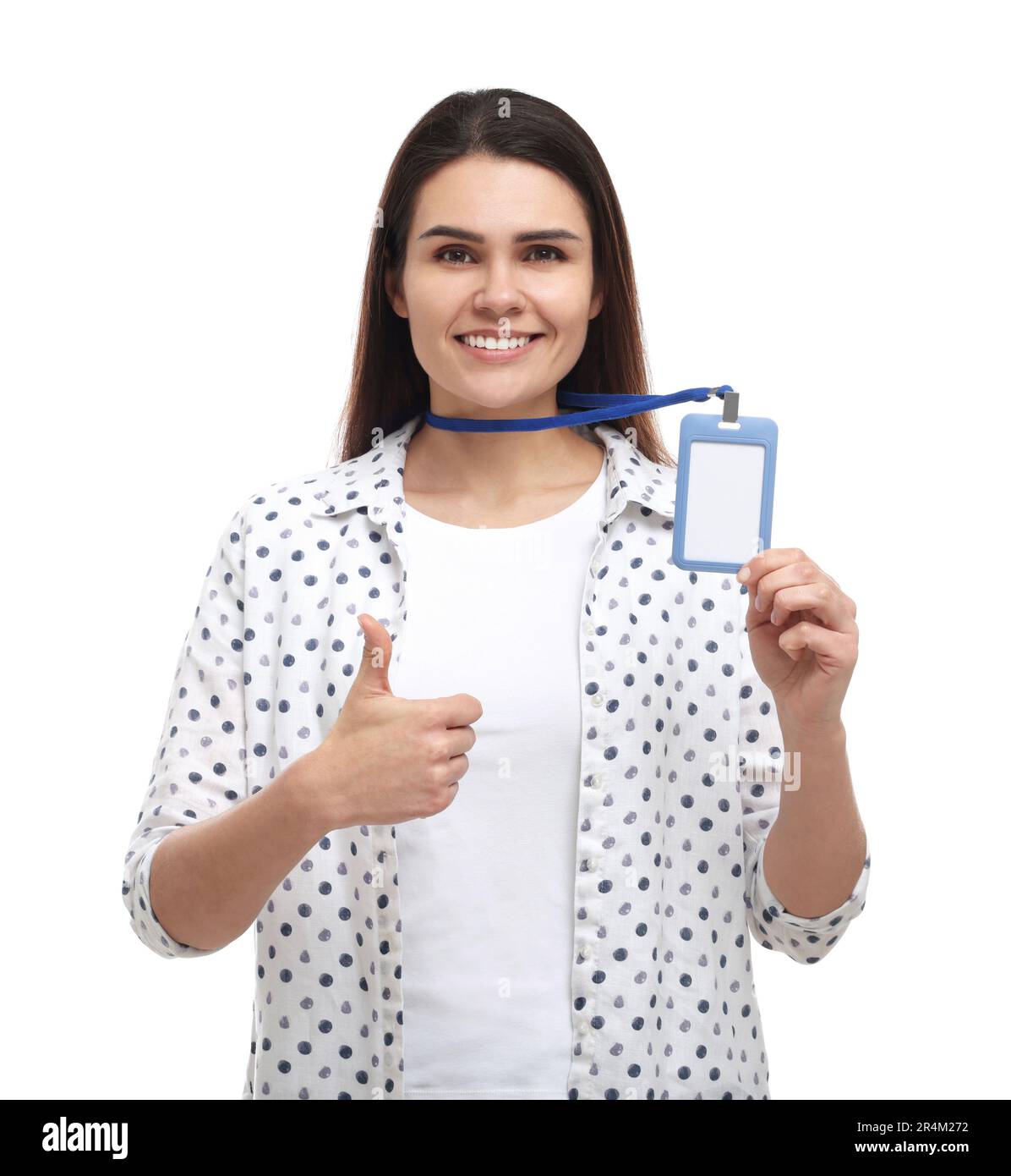 Happy woman with vip pass badge showing thumb up on white background ...