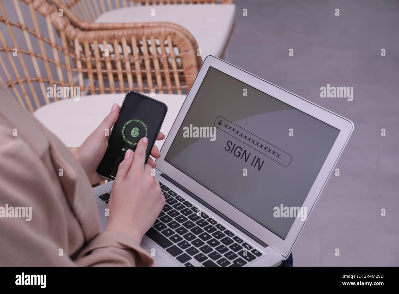 Woman unlocking smartphone with fingerprint scanner, closeup. Her ...