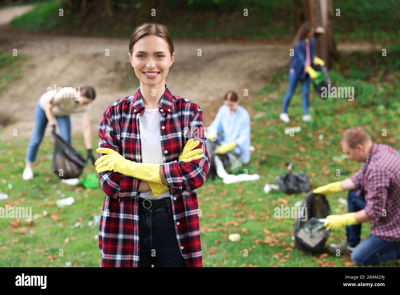Young people collecting garbage hi-res stock photography and images - Alamy