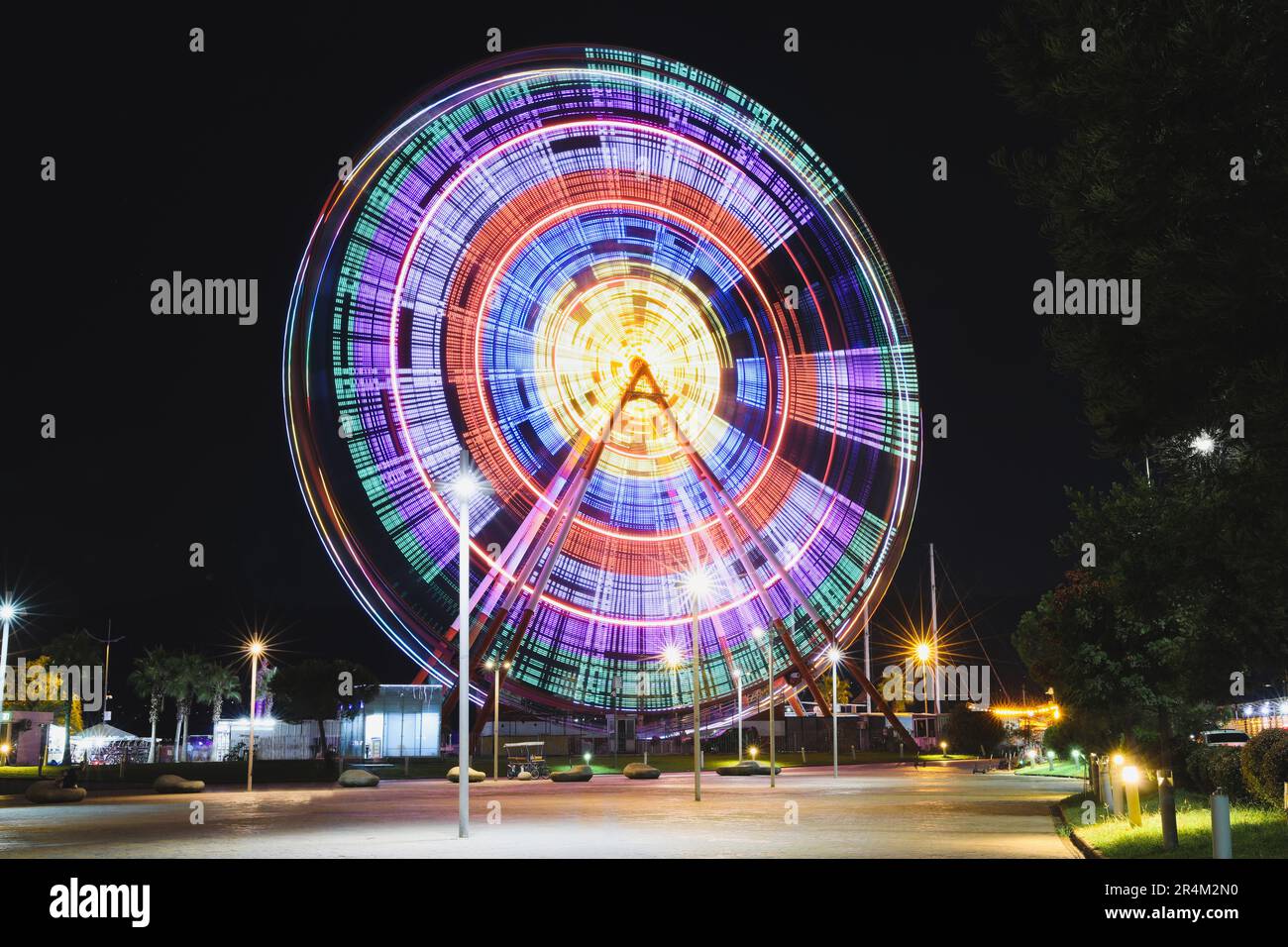 Beautiful glowing Ferris wheel against dark sky Stock Photo - Alamy