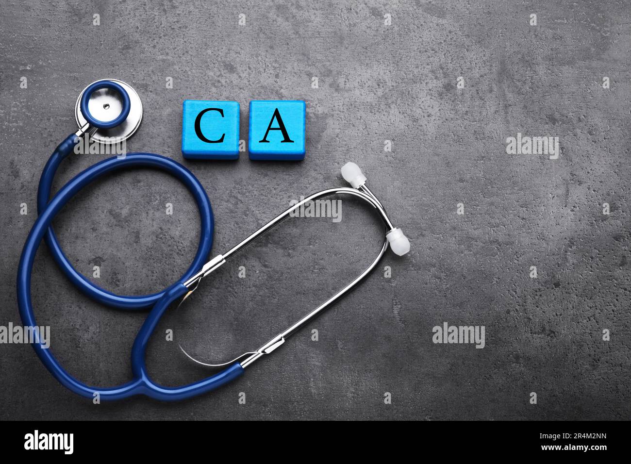 Light blue cubes with symbol Ca (Calcium) and stethoscope on black ...